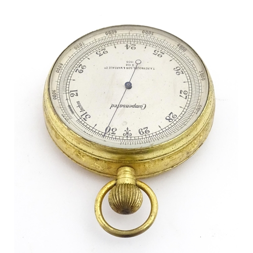 A brass cased pocket barometer / altimeter, the dial marked 'T. A ...