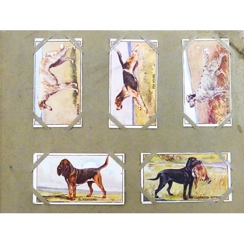 A quantity of British and worldwide postage stamps within albums ...