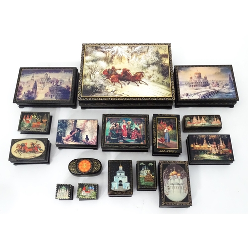 A quantity of Russian black lacquered boxes with printed decoration to ...