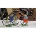 An Italian ceramic male and female figures on bicycle and penny ...
