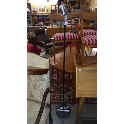 A vintage 1950's style Elvis microphone with a gravity weighted base ...