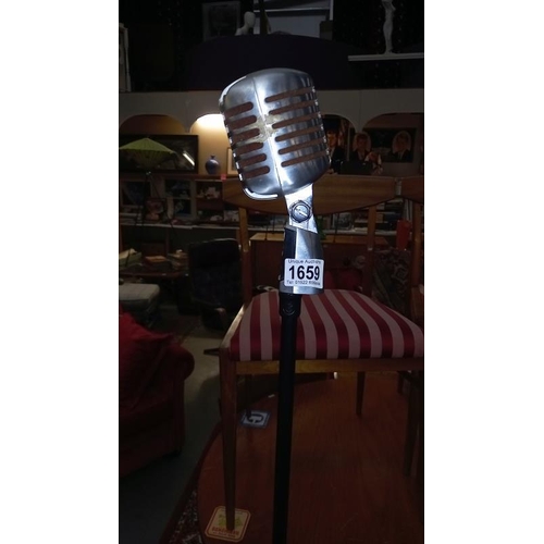 A vintage 1950's style Elvis microphone with a gravity weighted base ...