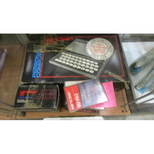 A vintage Sinclair ZX81 eith 16k ram and a quantity of games.