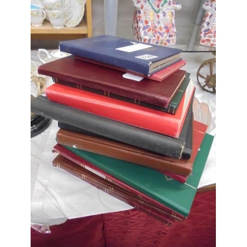 A collection of stamp albums including UK and world stamps.