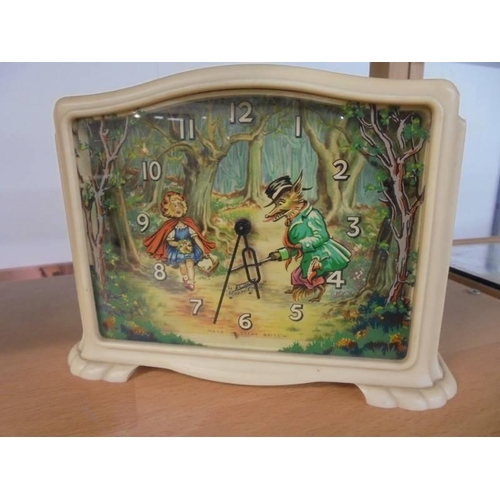 A Vintage Smiths Little Red Riding Hood musical mantel clock, (overwound).