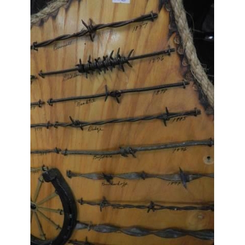 An unusual wall display of rare barbed wire samples, COLLECT ONLY.