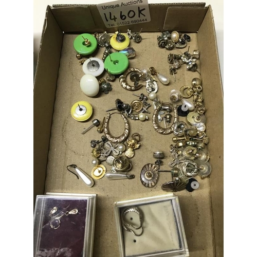 A large collection of various earrings