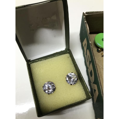 A large collection of various earrings