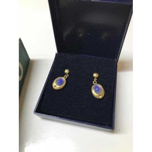 A large collection of various earrings