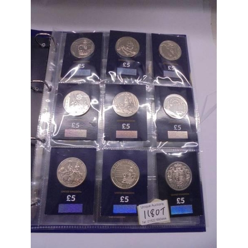 An album of 50p coins, crowns and other coins.