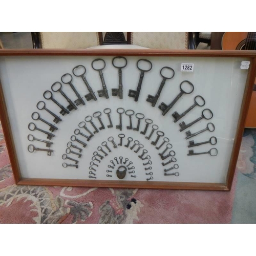 A framed and glazed collection of antique keys.