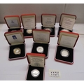 Eight cased silver proof coins including 1994 D-Day 50p, Piedfort etc.,