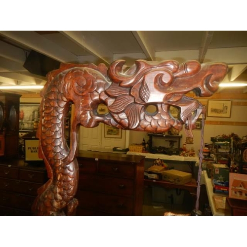 A top quality carved mahogany dragon standard lamp (will need re-wiring)