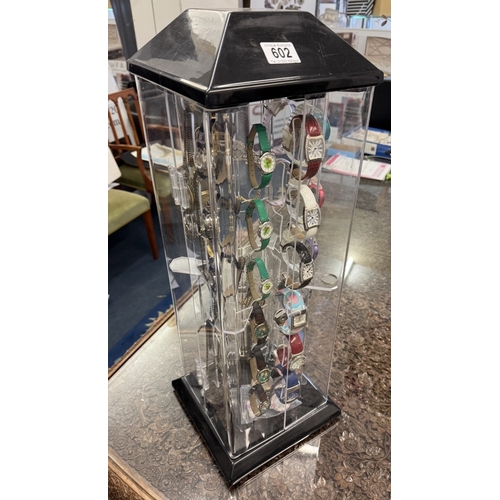 A watch display cabinet and a collection of watches including Le Chat