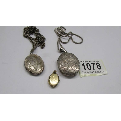 A silver locket with photo and plaited hair, another locket and a ...