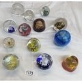 A quantity of art glass paperweights including 1 marked Jane Charles