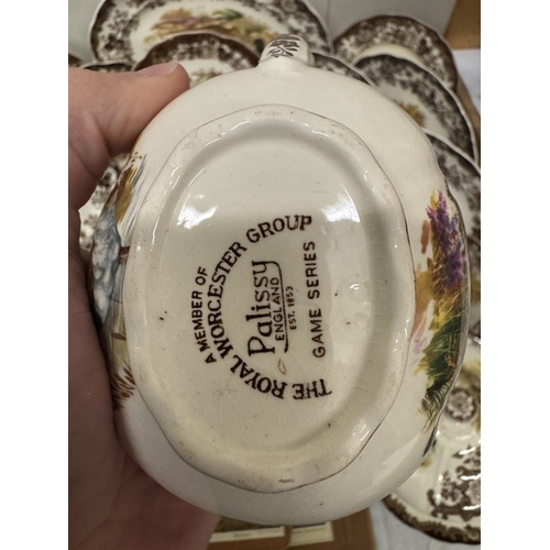 A Royal Worcester Palissy game series dinner set comprising of ...