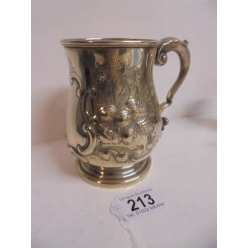 An early 20th century embossed silver plate tankard.