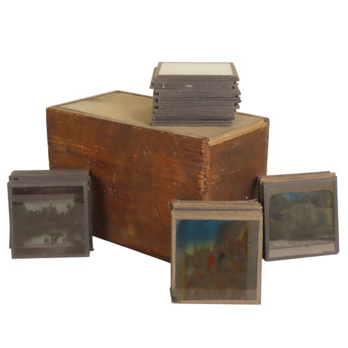 A COLLECTION OF VINTAGE GLASS LANTERN SLIDES, including thirty slides ...
