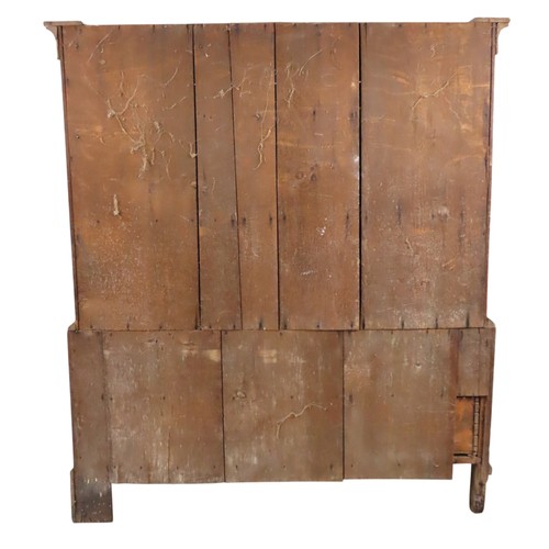 A 19TH CENTURY OAK CUPBOARD ON CHESTin two sections, the top section ...