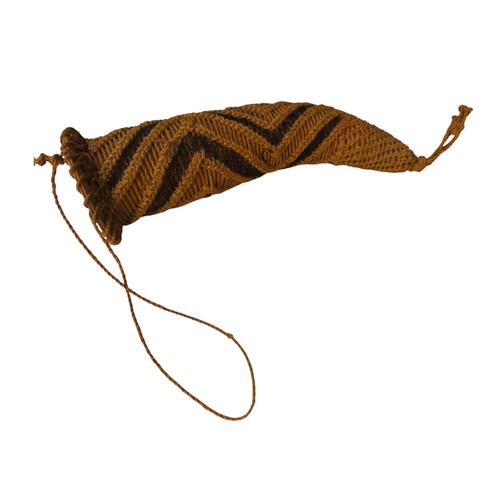 A WOVEN PHALLOCRYPT, GOROKA, made of vine fibre with painted pigment ...