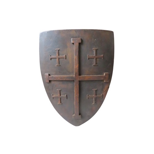 A LARGE WOODEN SHIELD SHAPED PLAQUE carved with a cross of the Knights ...