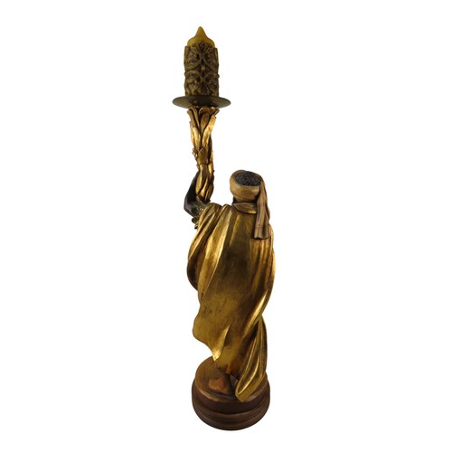 A VENETIAN CARVED WOODEN BLACKAMORE CANDLESTICK, with polychrome ...