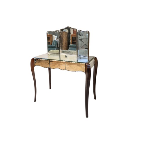 AN ART DECO MIRROR PANELLED DRESSING TABLEtriple mirror over a ...
