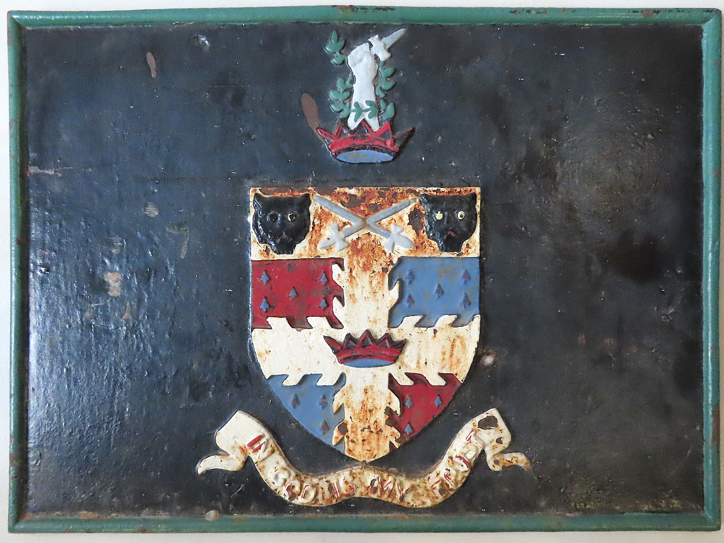 A CAST-IRON ARMORIAL PANELrelief decorated with shield bearing cross ...