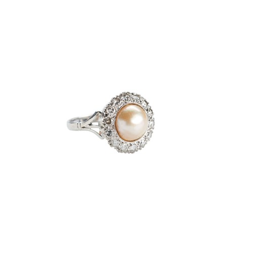 A MABE PEARL AND DIAMOND RING,the mabe pearl within a surround of ...