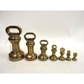 Set of seven Avery style brass bell weights