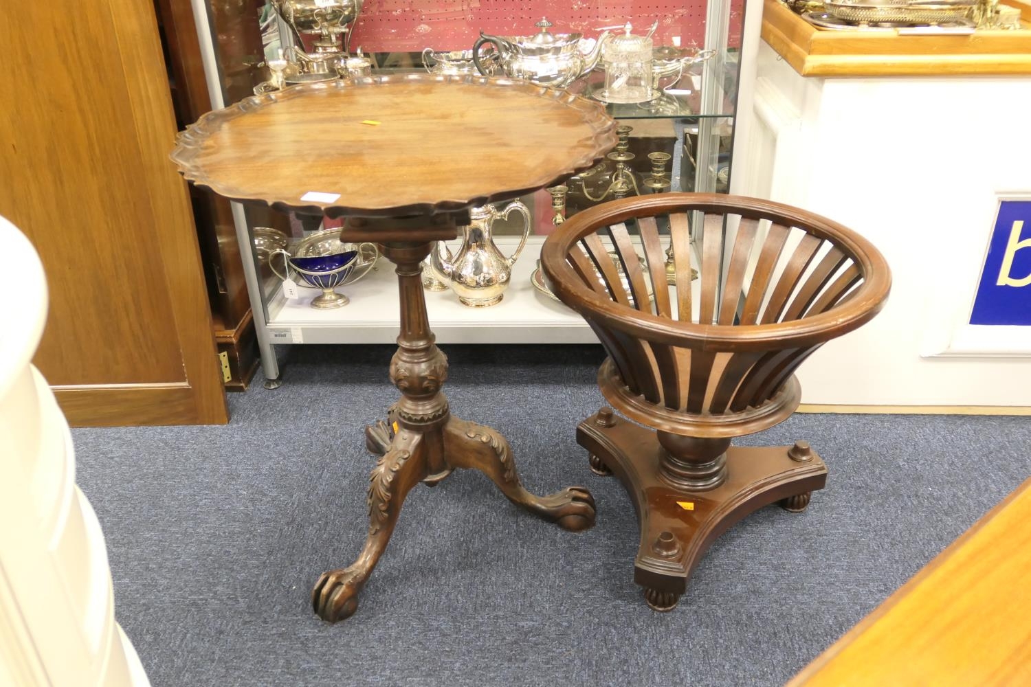 Mahogany pie crust pedestal tripod table in the Chippendale style; also ...