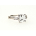Good diamond ring, centred with a rectangular step cut natural diamond ...