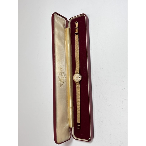 A MARVIN ladies watch with integral 9ct gold case and strap, 22.9gm ...