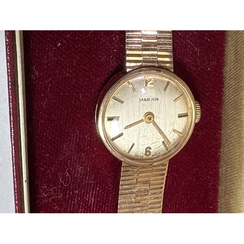 A MARVIN ladies watch with integral 9ct gold case and strap, 22.9gm ...