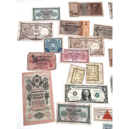 A selection of banknotes:WWII German and earlier German notes, other ...