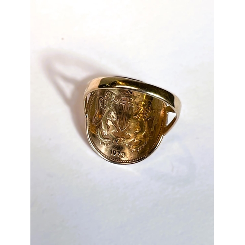A 9ct gold signet ring with Sovereign like coin frontage 3.9gms