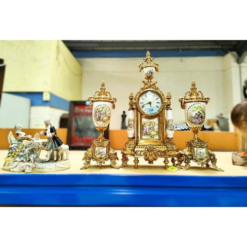A traditional ceramic and metal three piece clock garniture with quartz ...