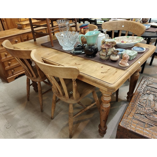 An extending pine farmhouse dining table with turned legs and internal ...