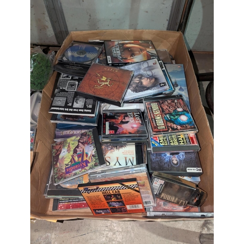 A collection of vintage PC CD-Rom games, Myst, River, Broken Sword II.