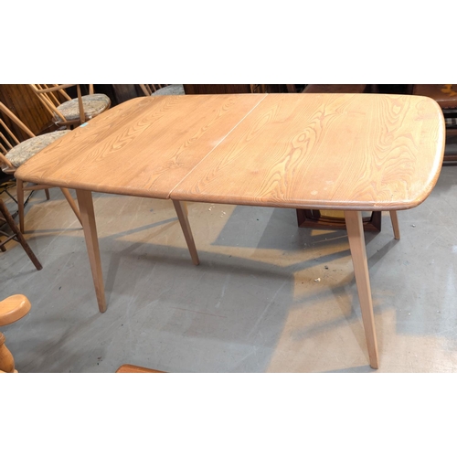 An Ercol Windsor 'Grand Plank' elm and beech extending dining table ...