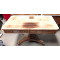 A 19th century mahogany rounded rectangular library table with 2 frieze ...