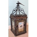 A Victorian hall lantern light with glass bird panels and brass finish.