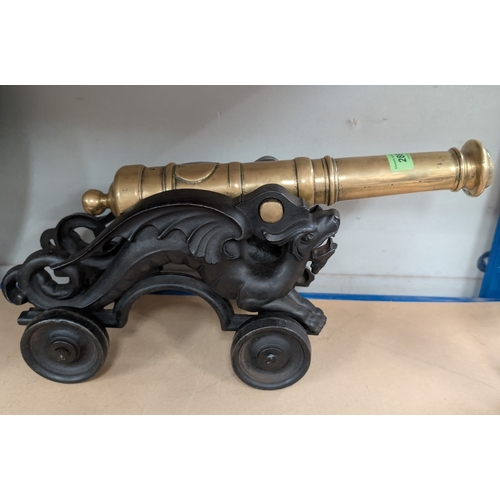 An Antique brass signal/ starter cannon on metal dragon base, length 46cm