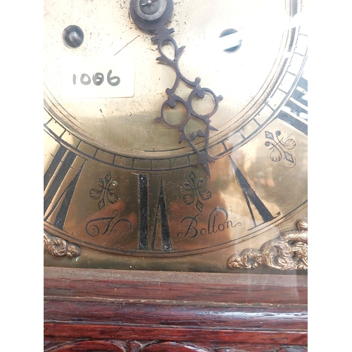A 19th century carved oak 8 day brass long case clock.