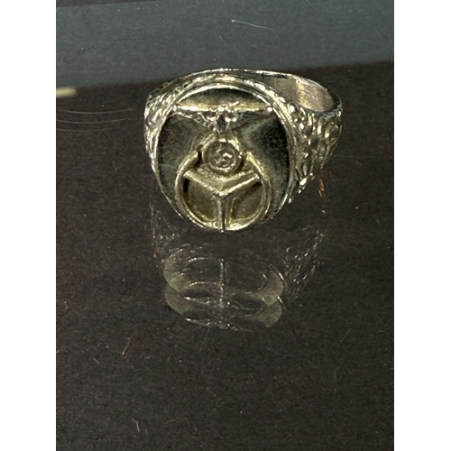 A German WWII third Reich ring with Mercedes badge.