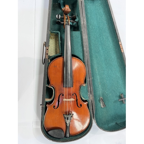 A 19th century violin with single piece back, mother of pearl inlaid ...