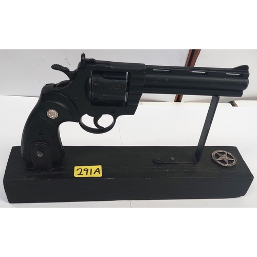 A Denix replica Colt Python pistol.