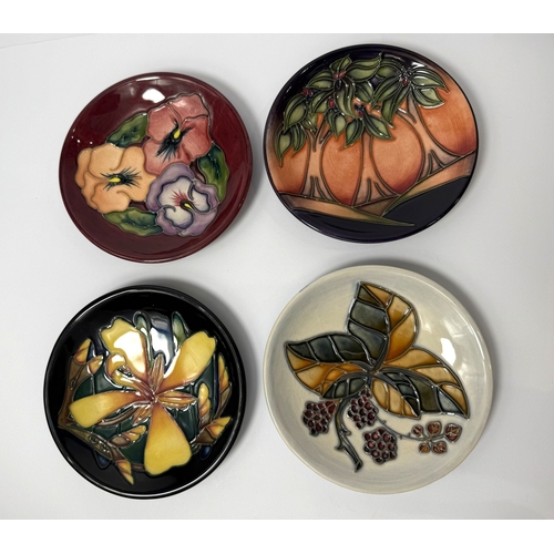Four moorcroft pin trays / coasters:- Pansy pattern against a burgundy ...