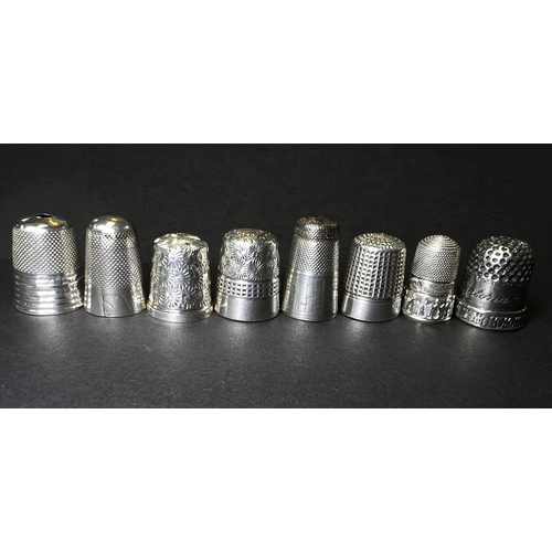 A collection of 50 hallmarked silver and white metal thimbles (approx ...